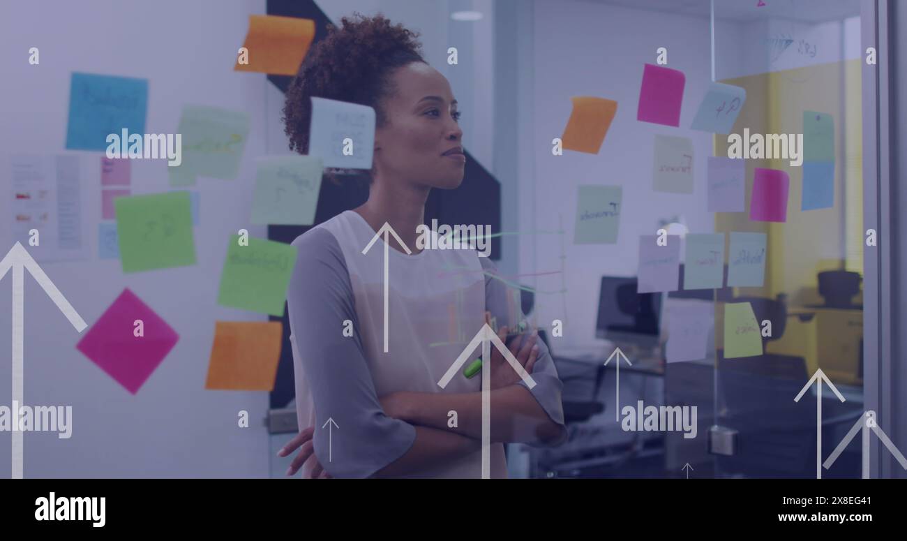 Image of arrow icons moving upwards over biracial woman smiling looking ...