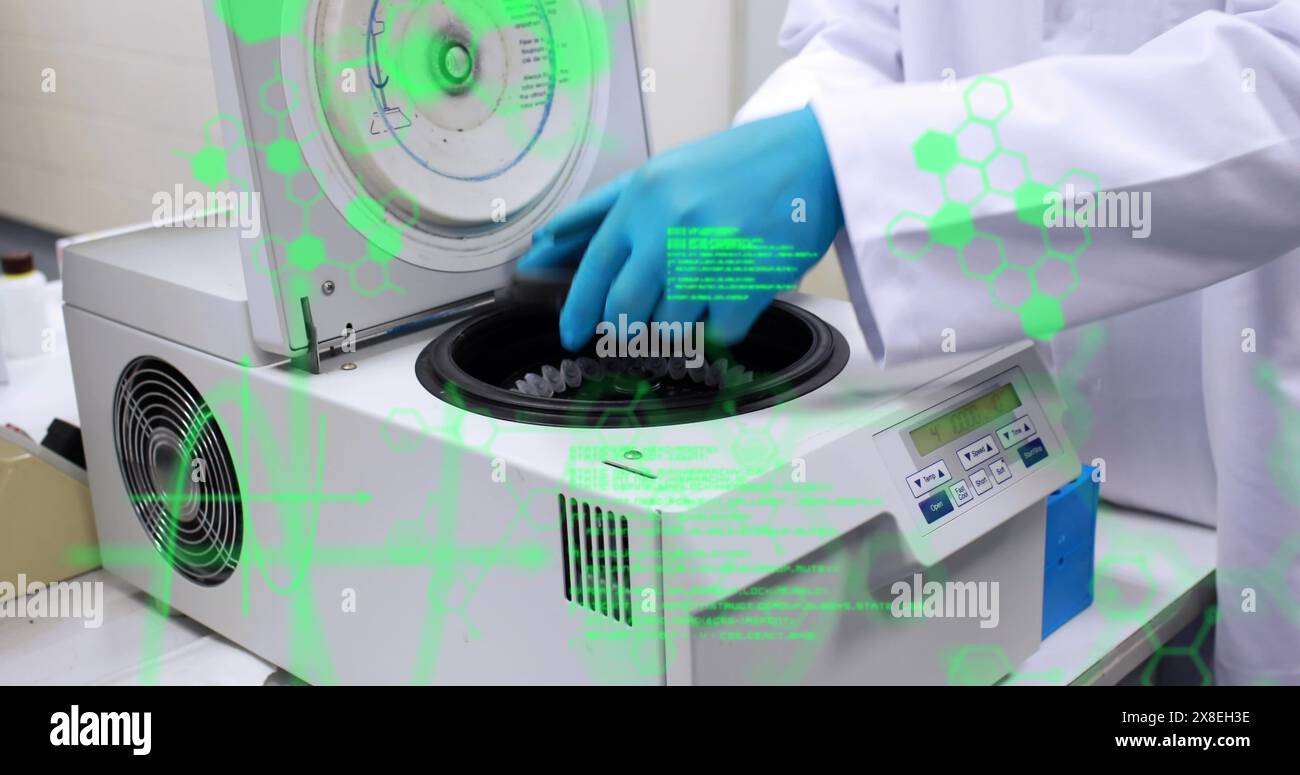 Image of data processing over mid section of a scientist using ...