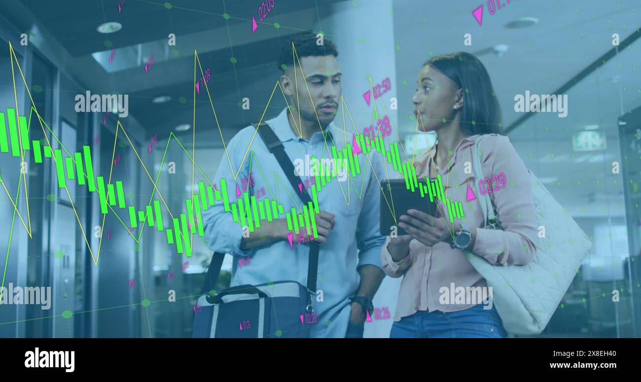 Image Of Data Processing Against Diverse Man And Woman Discussing Over A Tablet At Office Stock