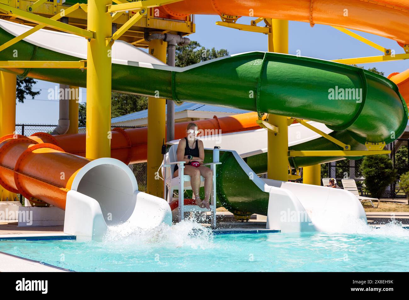A female lifeguard watches over the pool in the water park at Jury Pool ...