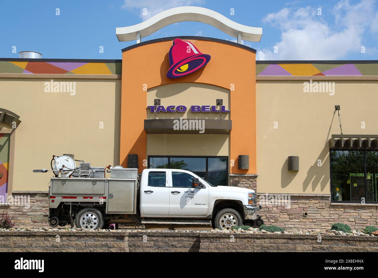 A truck is seen at the drive-thru window of a Taco Bell fast food ...