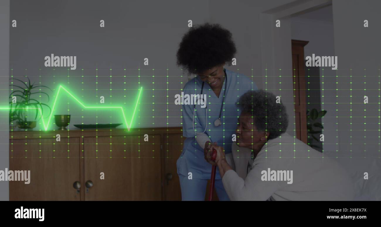Image of heart rate monitor over diverse female healthworker helping ...