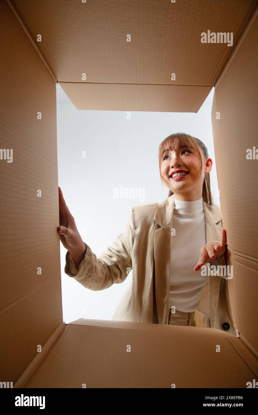 Unpacking the parcel, a girl with emotions unpacks the parcel, shot ...