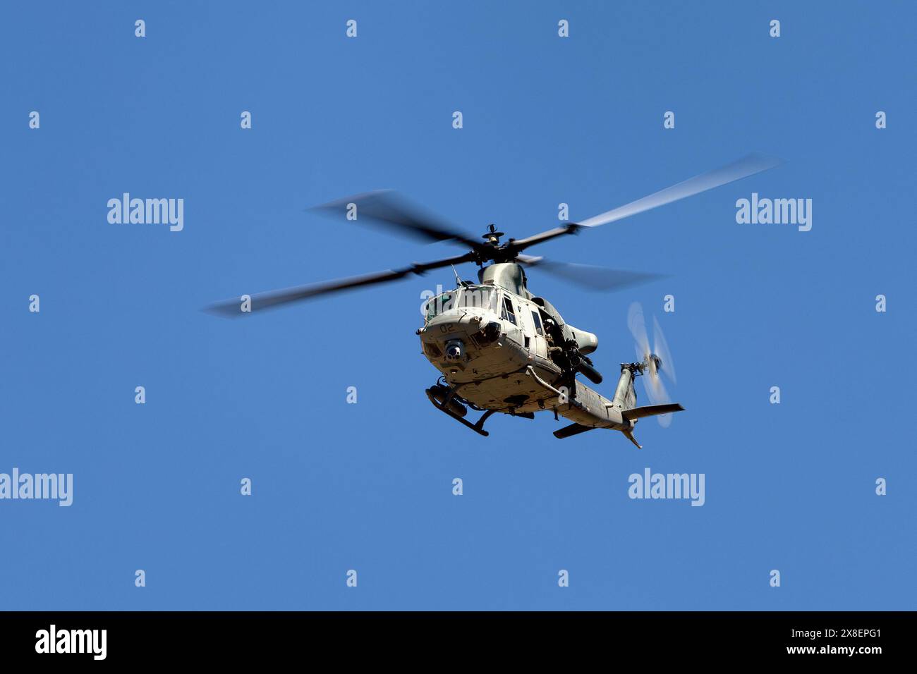 A United States Marines UH-1Y Venom helicopter flies along the ...