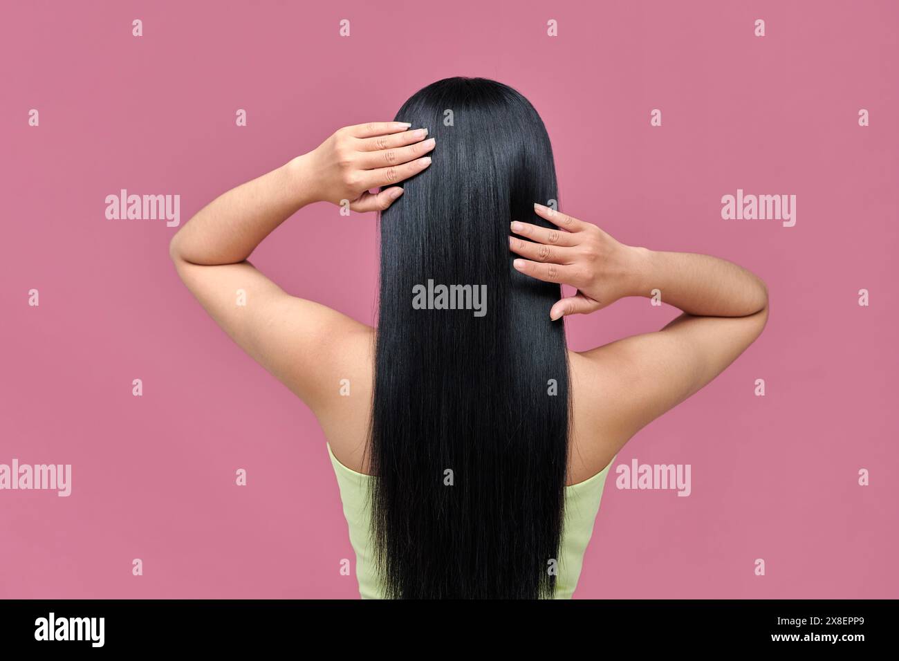 Back view woman touching her hair Stock Photo - Alamy