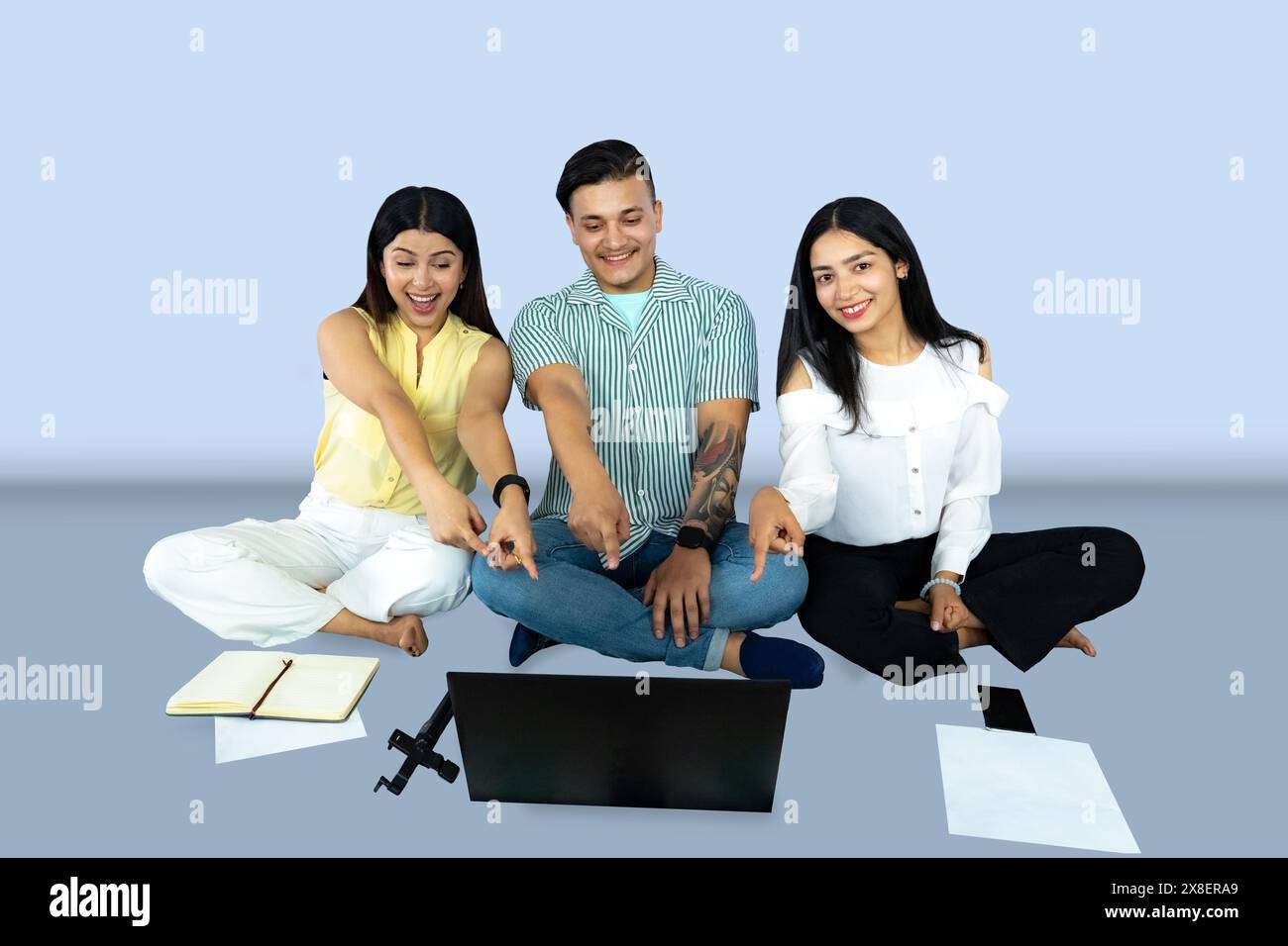 A group of copywriter friends with notepad, mobile phone, laptop giving ...