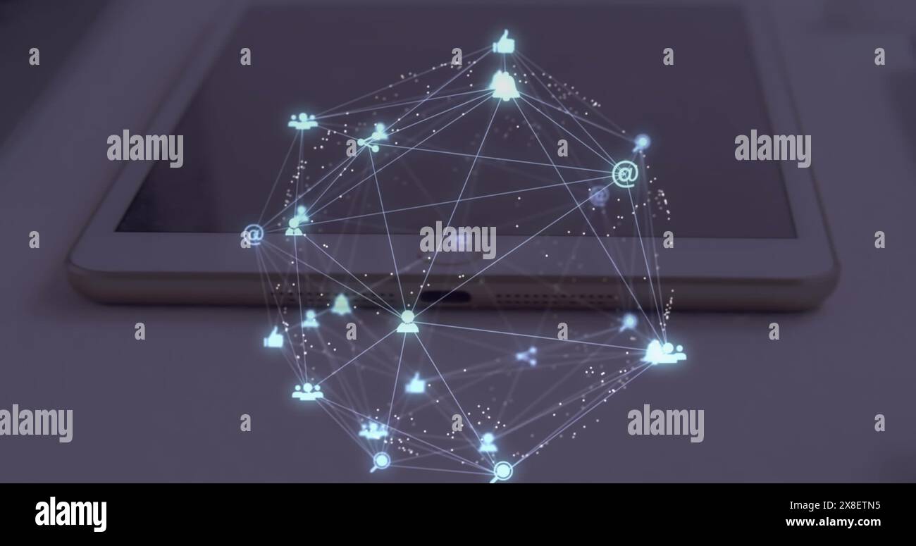 Image of globe of digital icons spinning against close up of office ...
