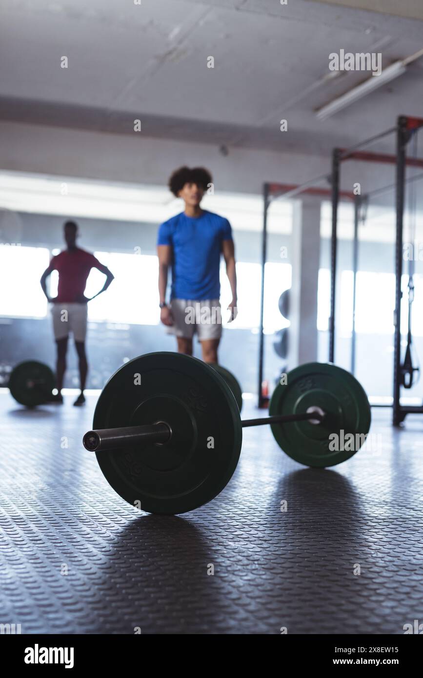 Two men lifting weights in gym hi-res stock photography and images - Alamy