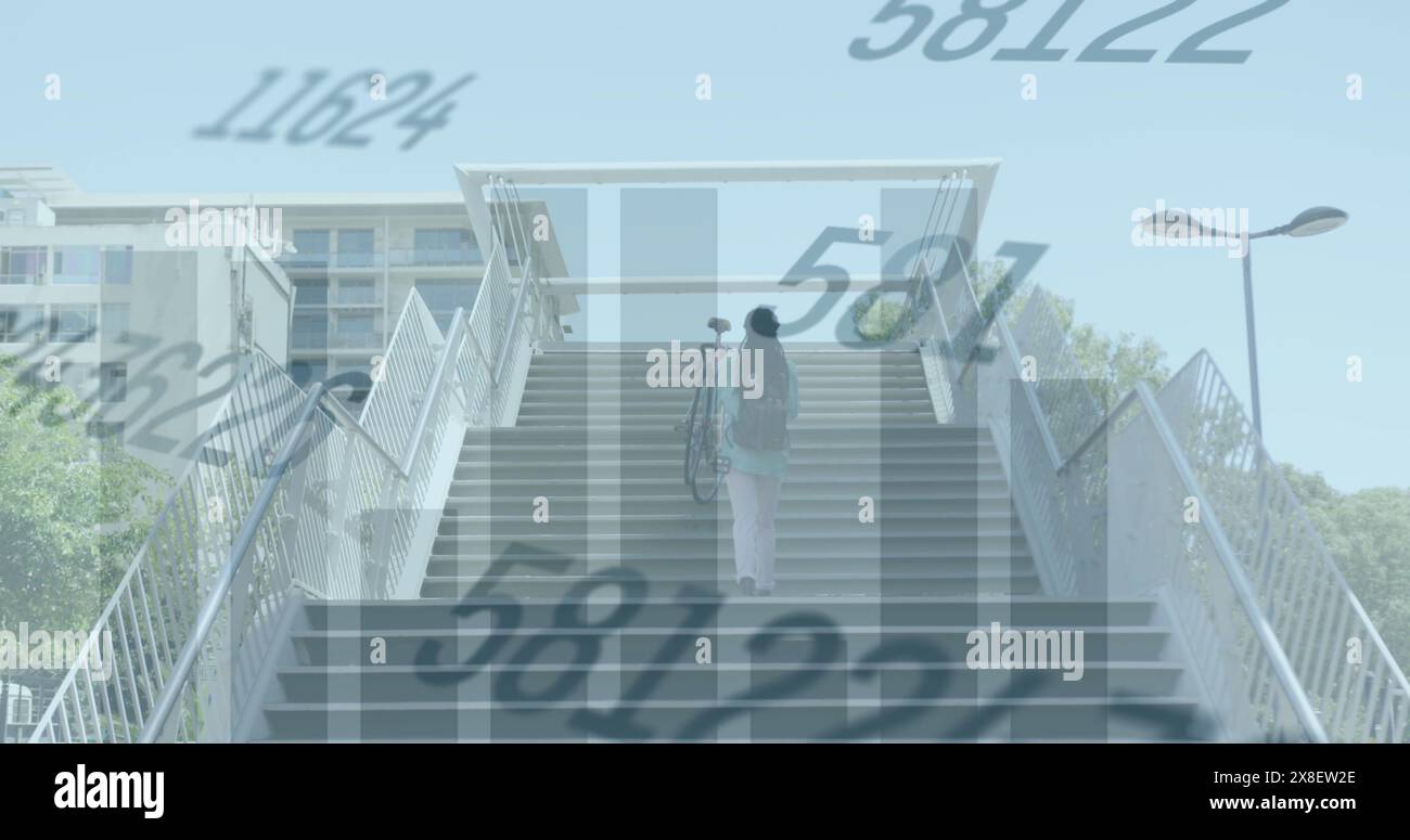 Image of changing numbers, graphs, rear view of man carrying bicycle ...