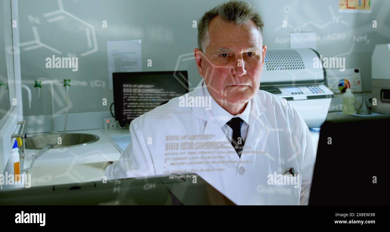 Caucasian senior male scientist wearing white lab coat standing in ...