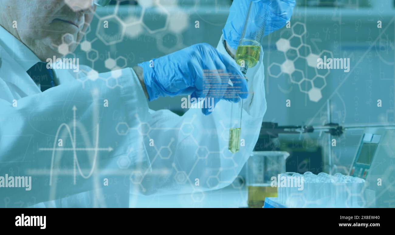 Caucasian senior male scientist pouring liquid into test tube Stock ...