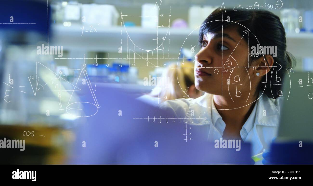 Image of scientific data processing over biracial female scientist ...
