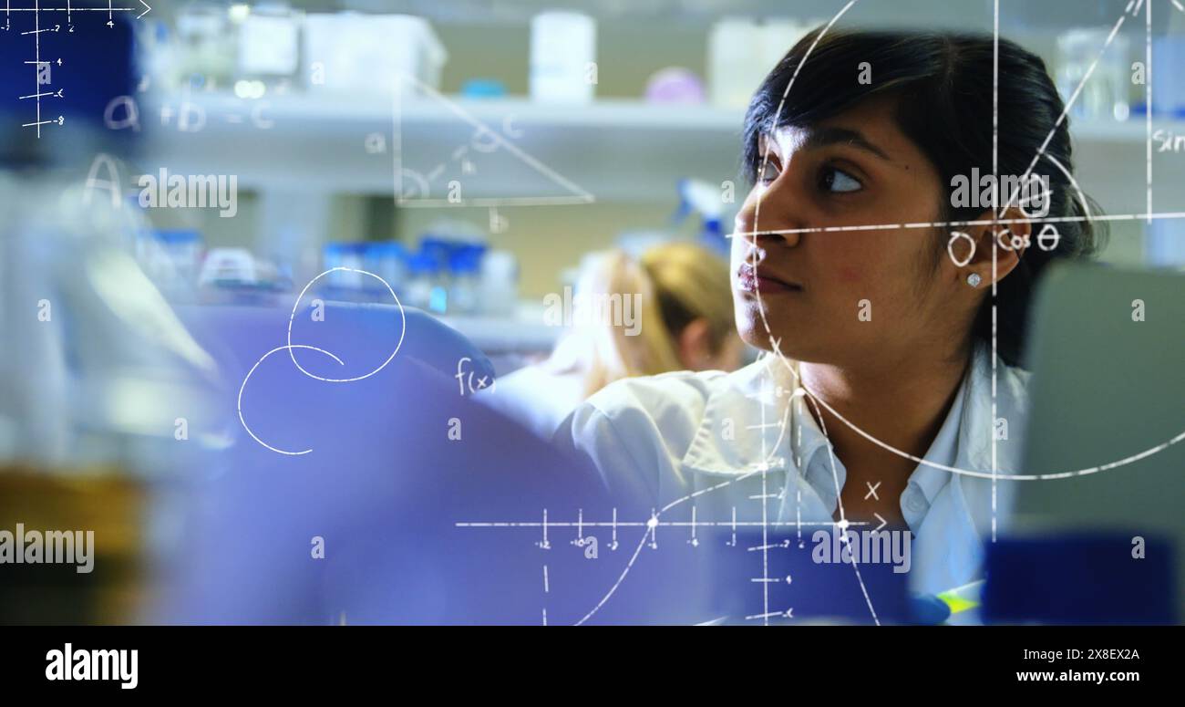 Image of scientific data processing over biracial female scientist ...