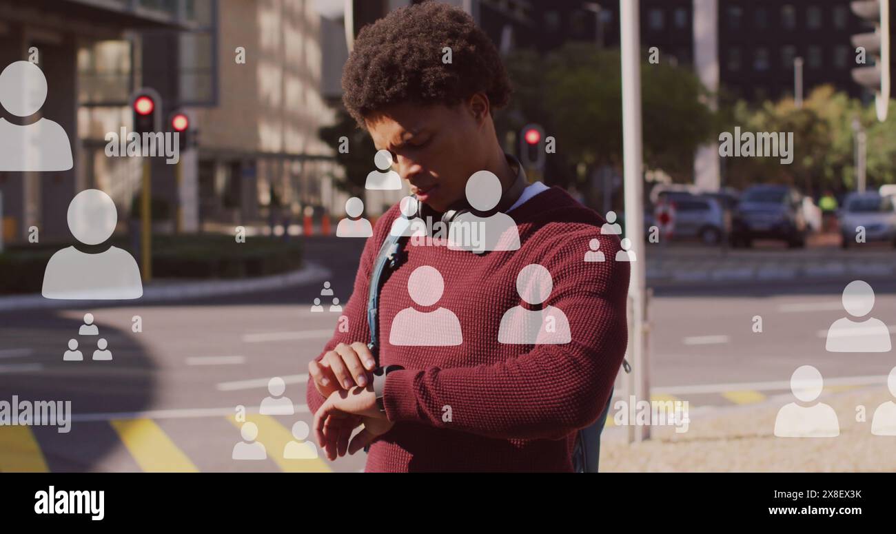 Image of people icons and data processing over african american man ...