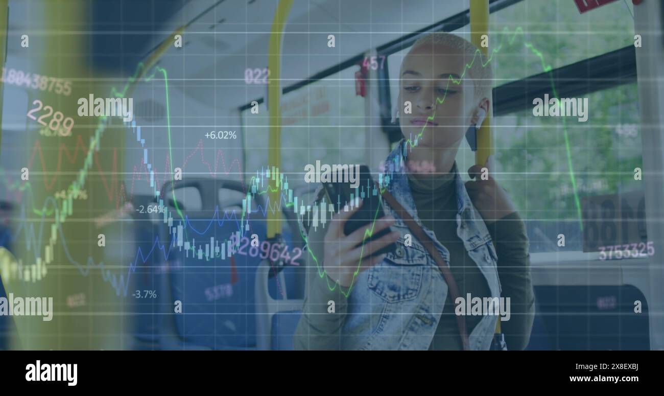 Image of graphs, changing numbers, biracial woman wearing headphone and listening music on bus ...