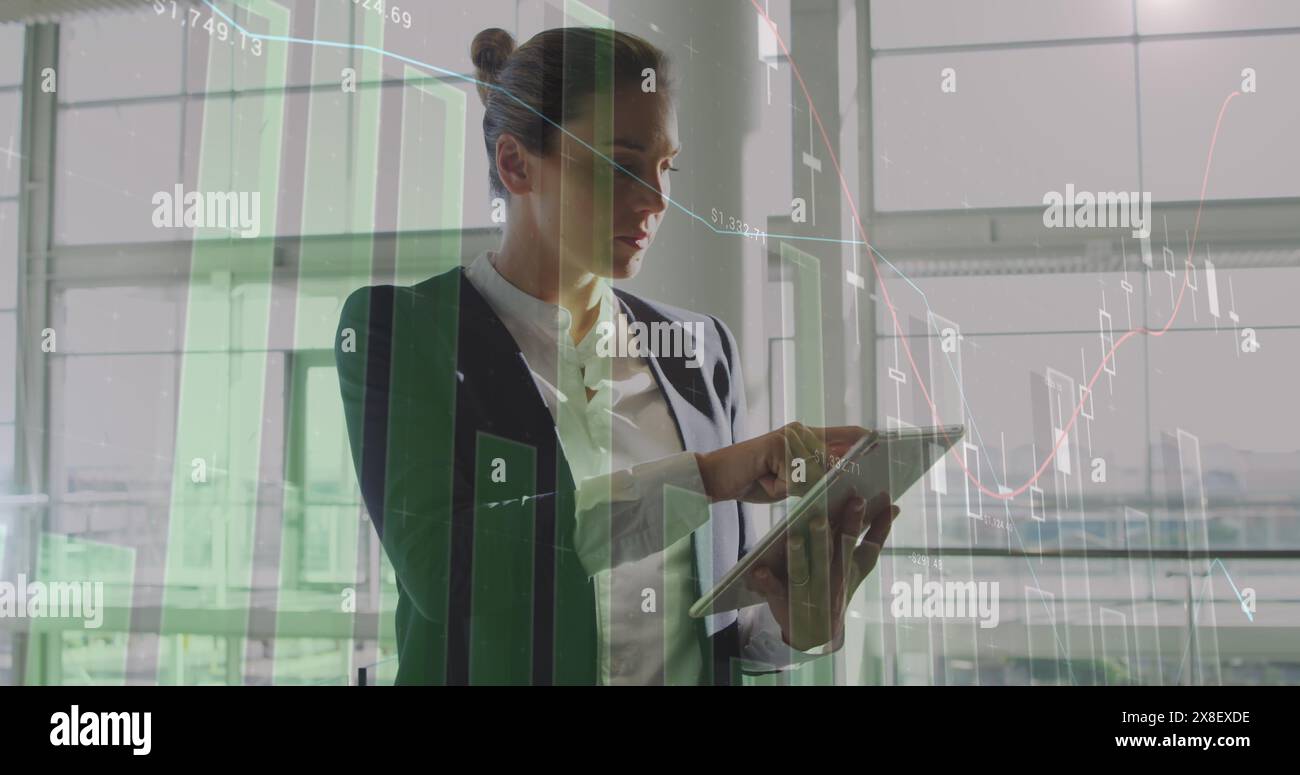 Image Of Statistical Data Processing Over Caucasian Businesswoman Using Digital Tablet At Office