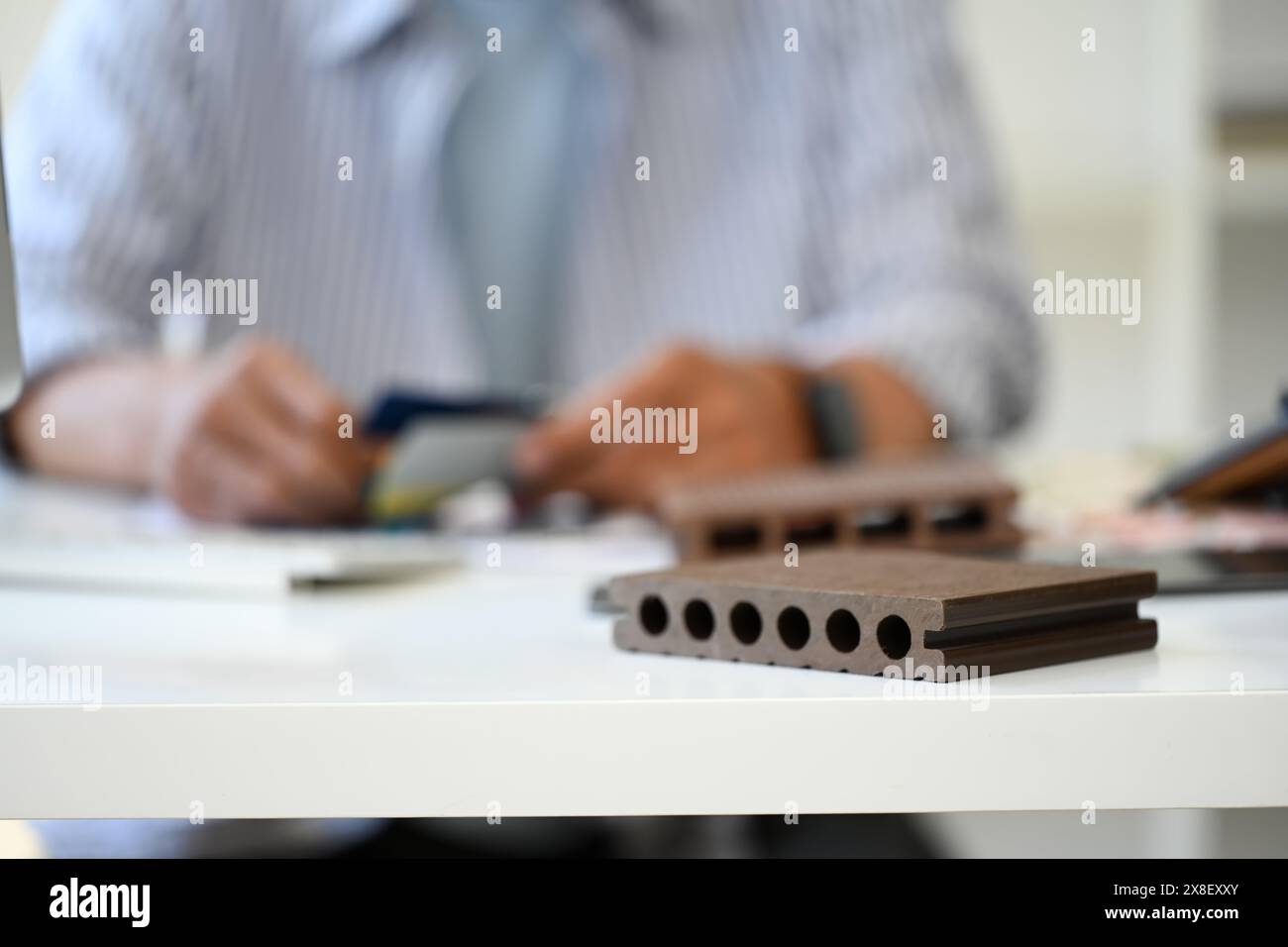 Sample solid wooden battens on white table with interior designer ...