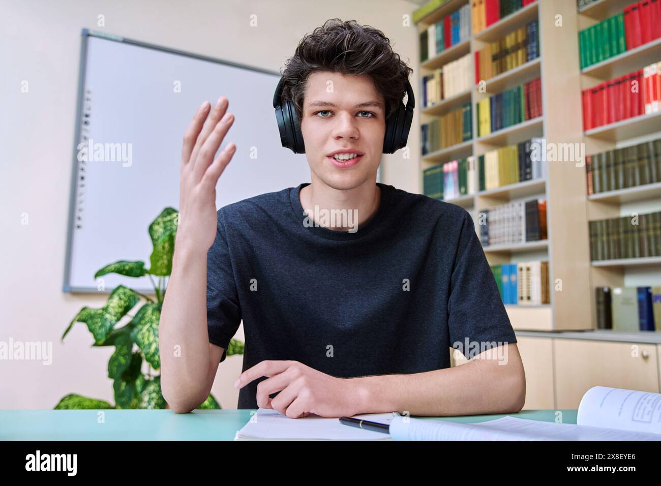 Web cam portrait of college student guy in headphones looking talking ...