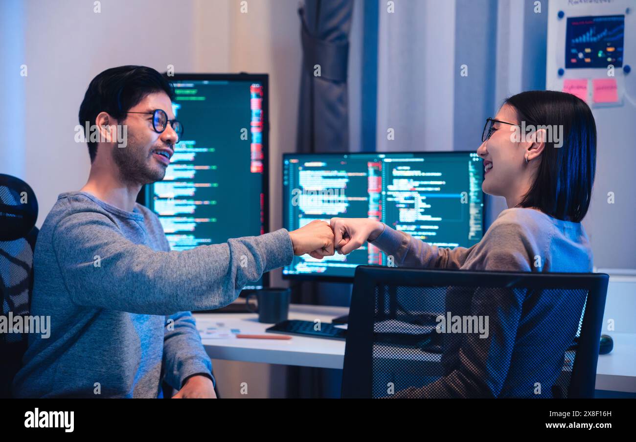 asian and Indian Developer team clapping hand for project success with ...