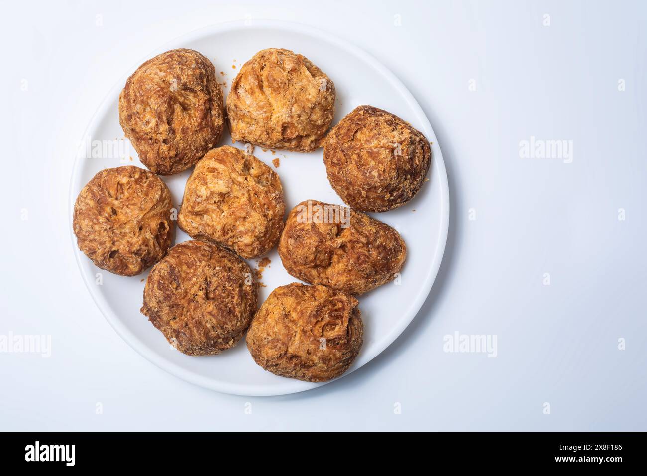 Indian famous tea snacks ooty varkey pastry on white plate on a white ...
