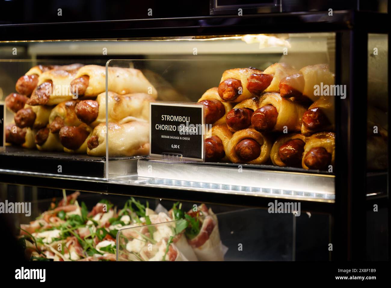 Iberian sausage rolls in a display case, close up. Madrid, Spain Stock ...
