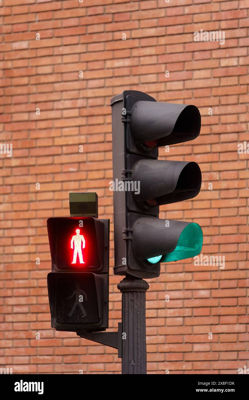 Traffic Light Showing Red Pedestrian Signal against the red brick wall ...