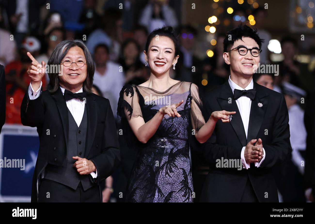 Cannes, France. 24th May, 2024. Director Peter Ho-sun Chan (L), actress Zhang Ziyi (C) and actor ...