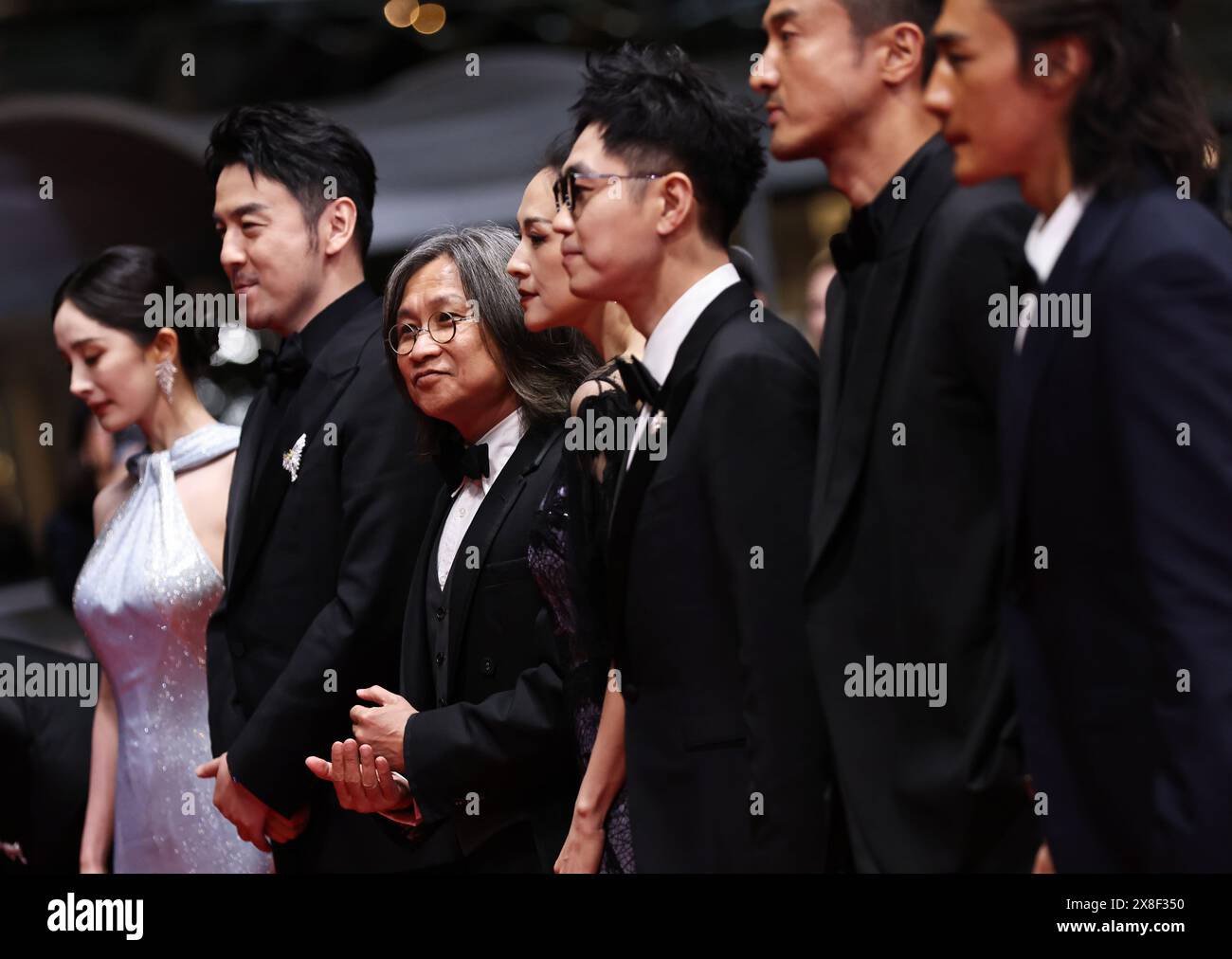 Cannes, France. 24th May, 2024. Director Peter Ho-sun Chan (3rd L) arrives with cast members for ...