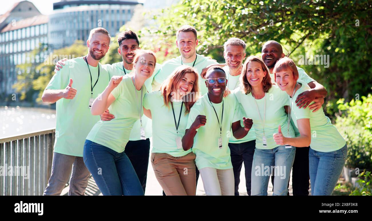 Happy Volunteer Group Celebrate. Altruism And Teamwork Stock Photo - Alamy