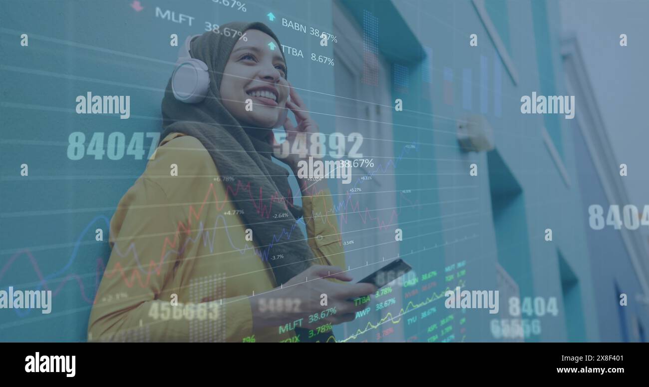 Image of data processing over woman in hijab wearing headphones ...