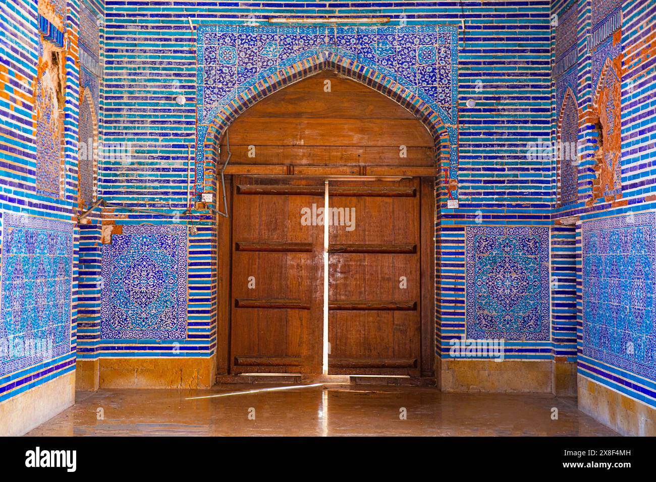 Wooden oriental door in Shah Jahan Mosque in Thatta, Pakistan. Also ...