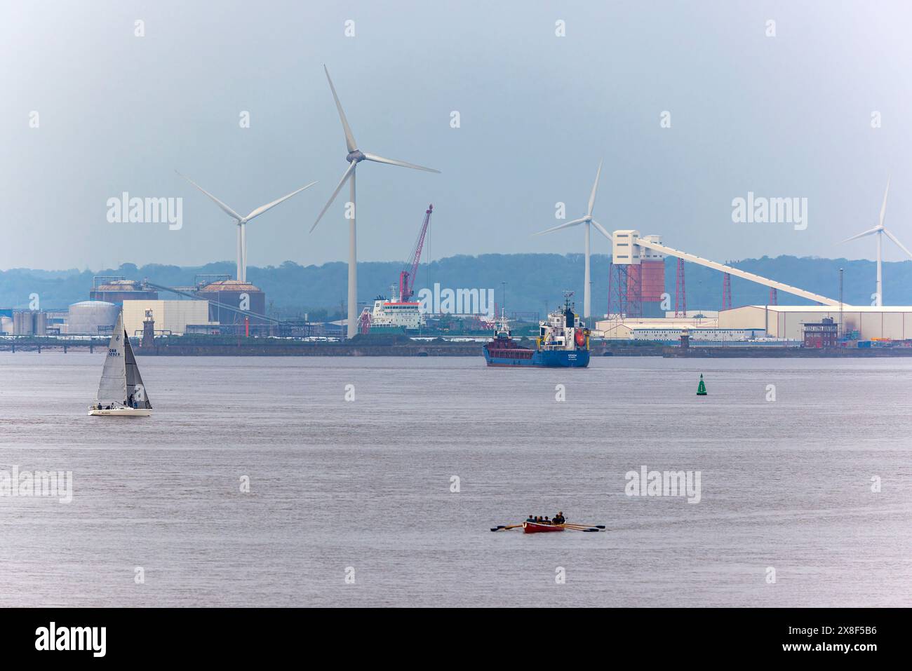 Wind turbines Avonmouth docks with vessel heading for port a sailing ...