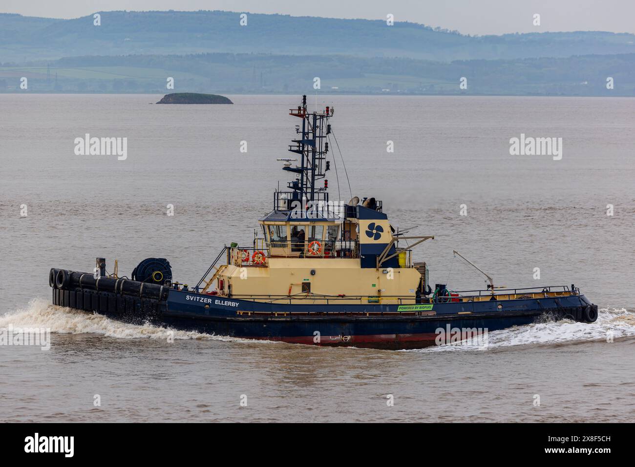 Tug Svitzer Ellerby heading out to meet container vessel and guide it ...