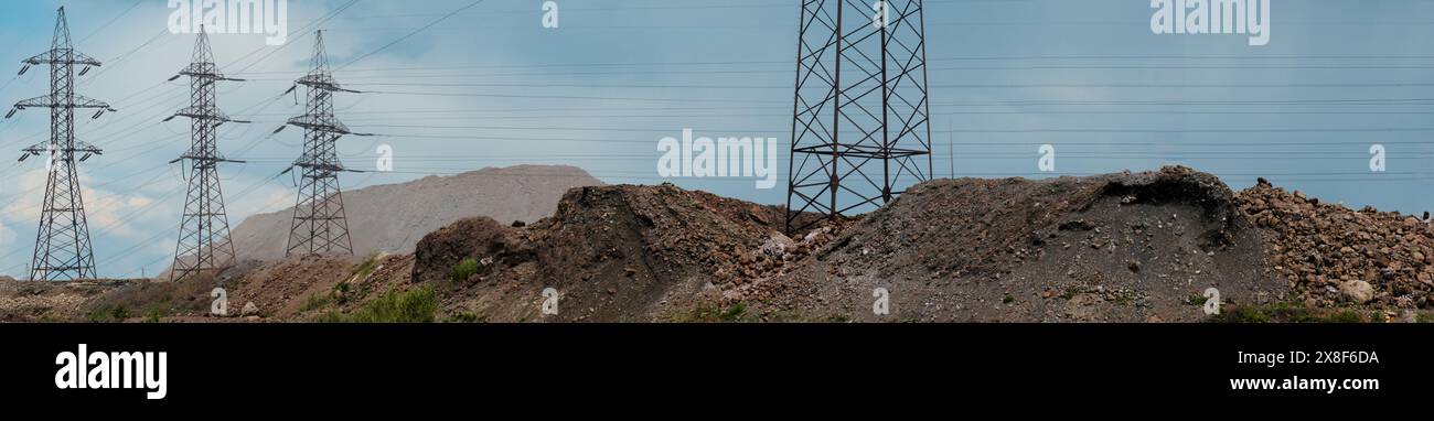Industrial power Towers and lines releasing - industrial area with slag ...