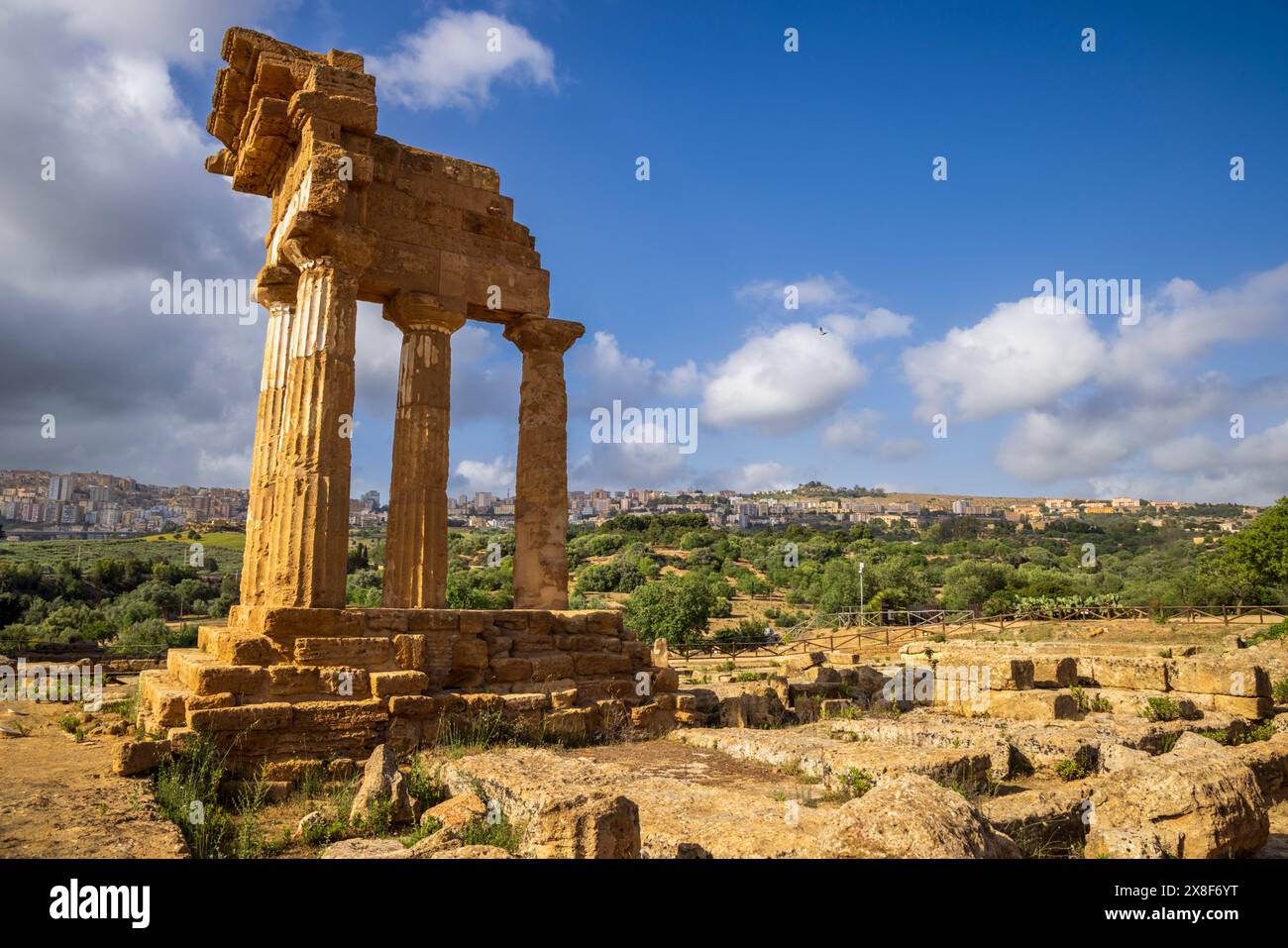 The Greek Temple of Castor and Pollux with Agrigento in the background ...