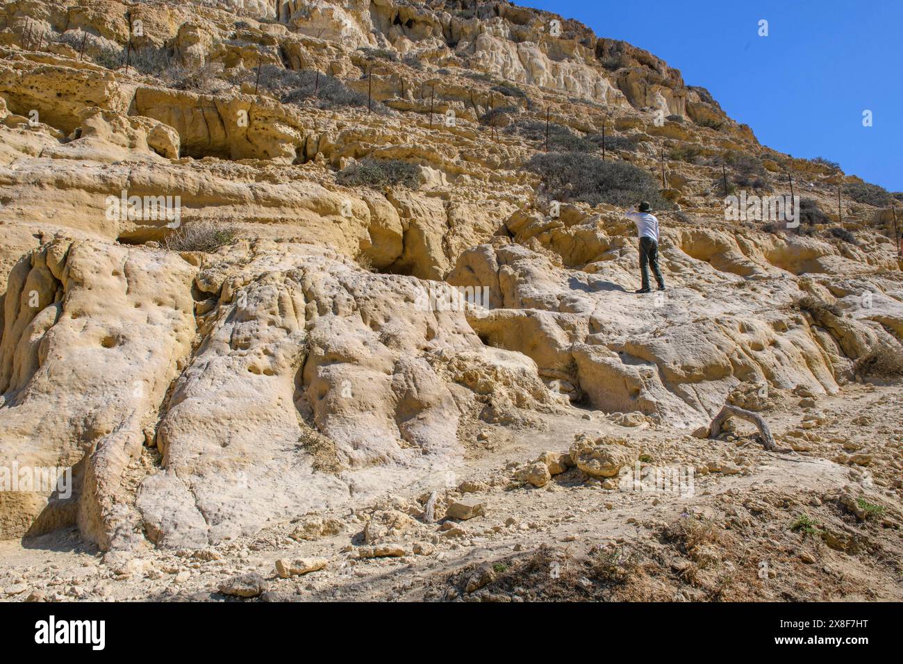 Tourist climbing on via ferrata up to former Roman necropolis with ...