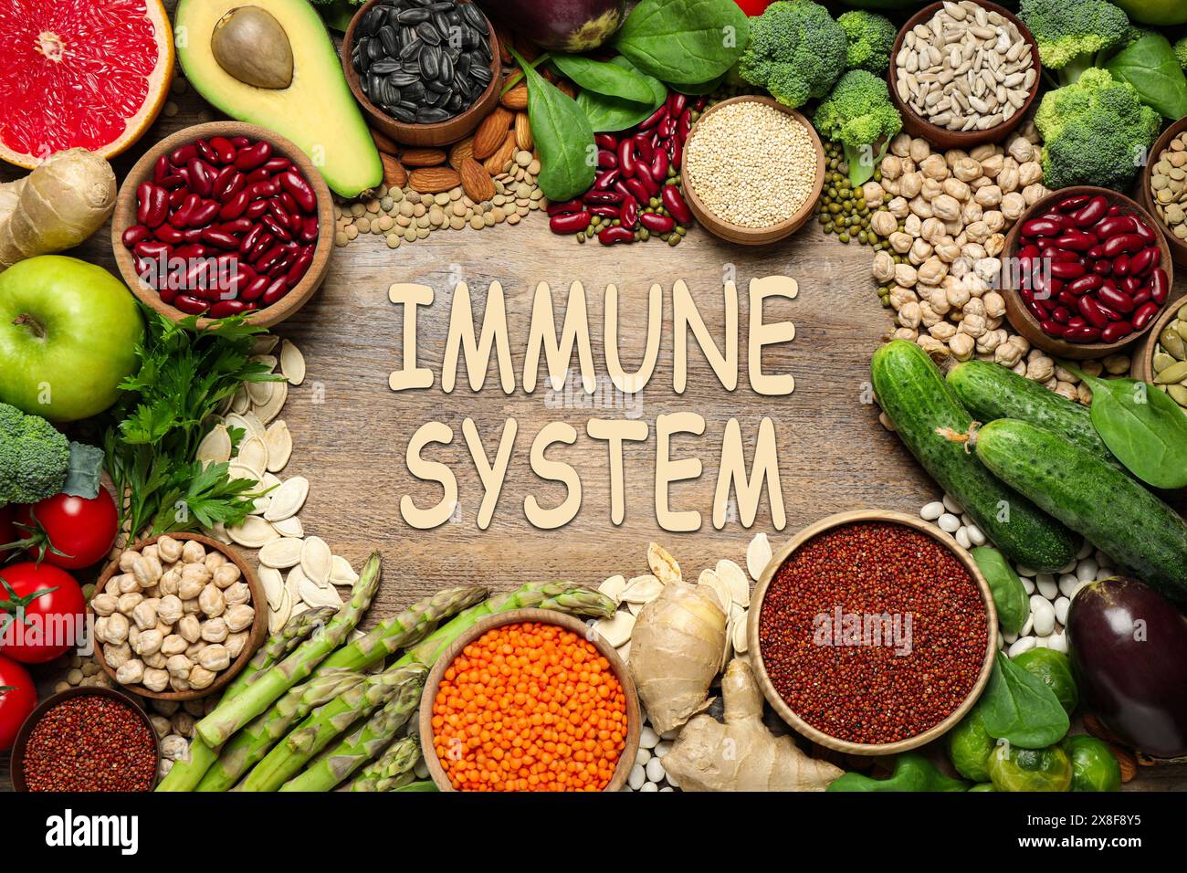 Immune system boosting with proper nutrition. Different foods on wooden ...