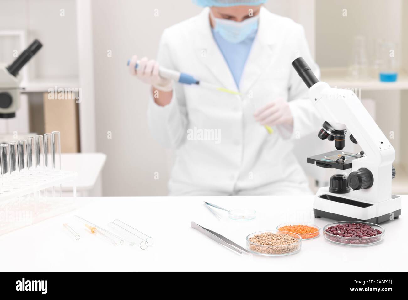 Quality control. Food inspector working in laboratory, focus on ...