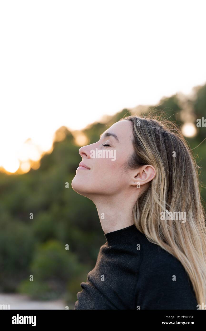 Vertical portrait of a woman breathing fresh air. Inner peace Stock ...
