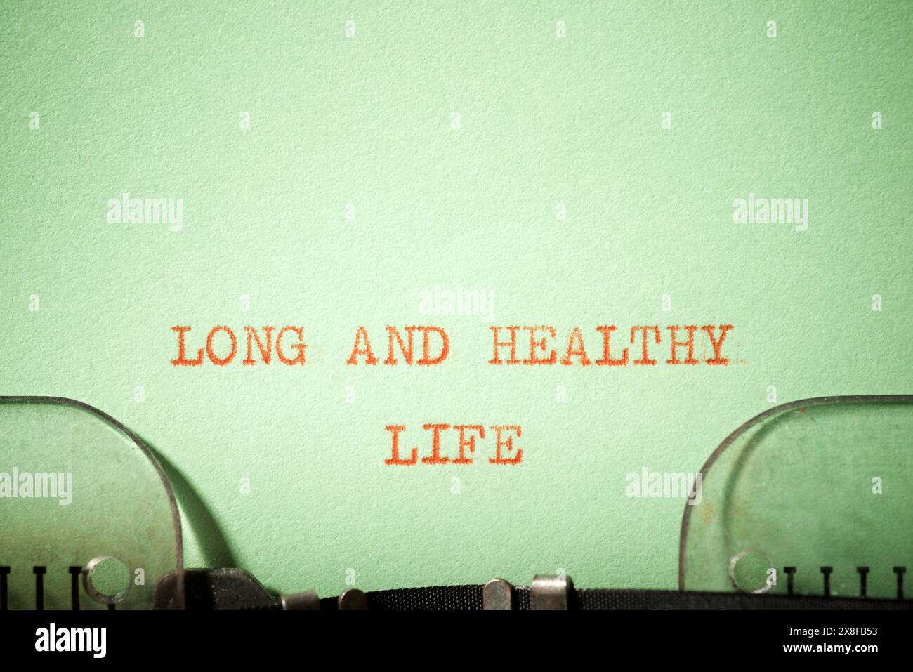 Long and healthy life text written with a typewriter Stock Photo - Alamy