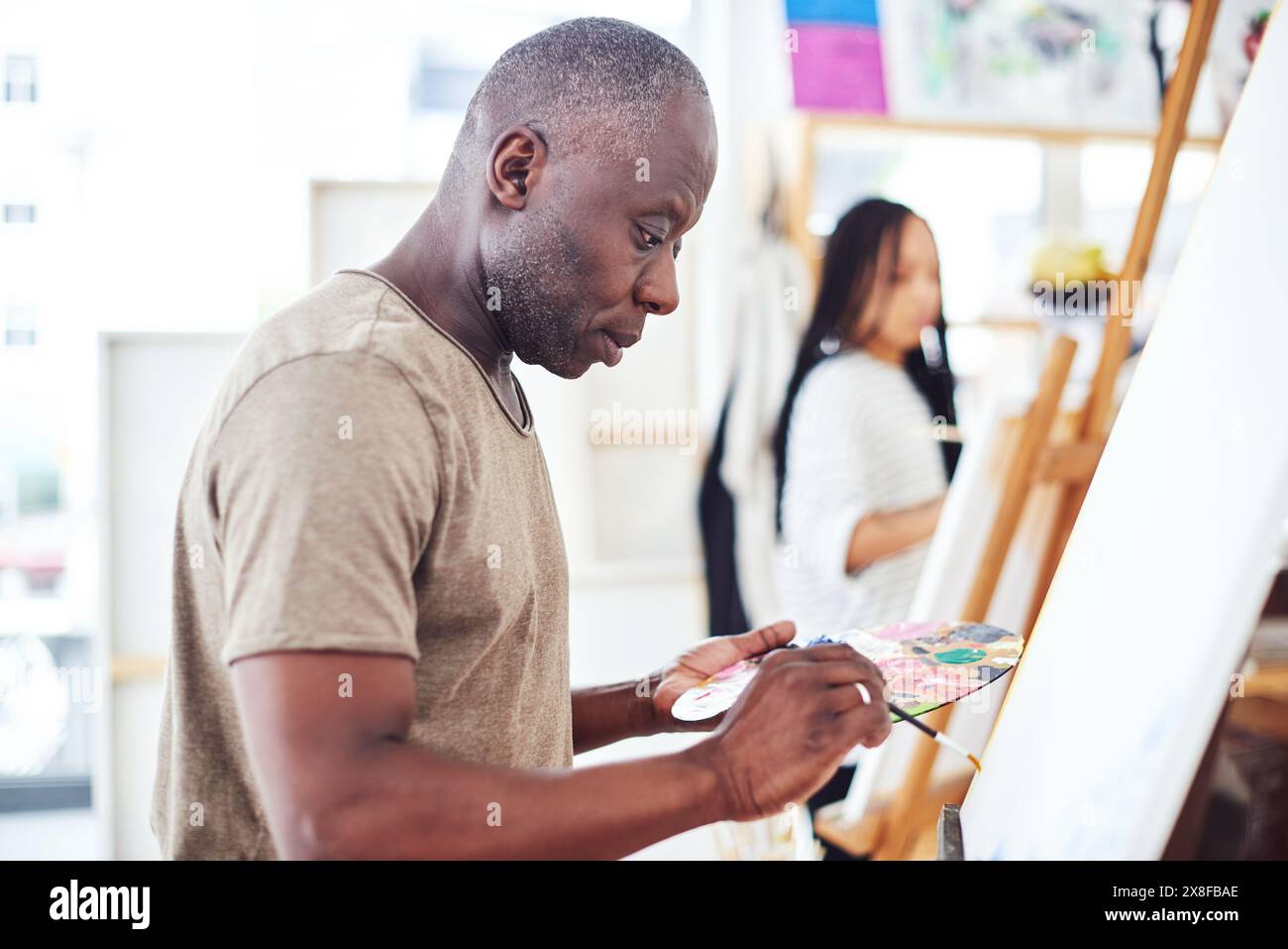 Black man, painting and creative studio or art easel with watercolor ...