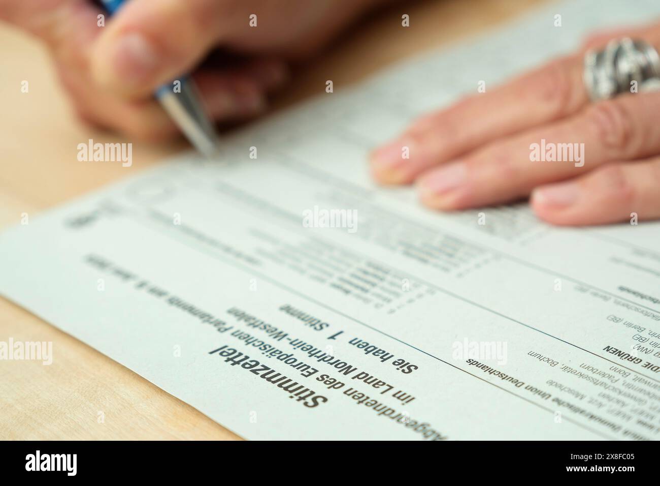 Postal vote: Woman fills out the ballot paper for the 2024 European ...