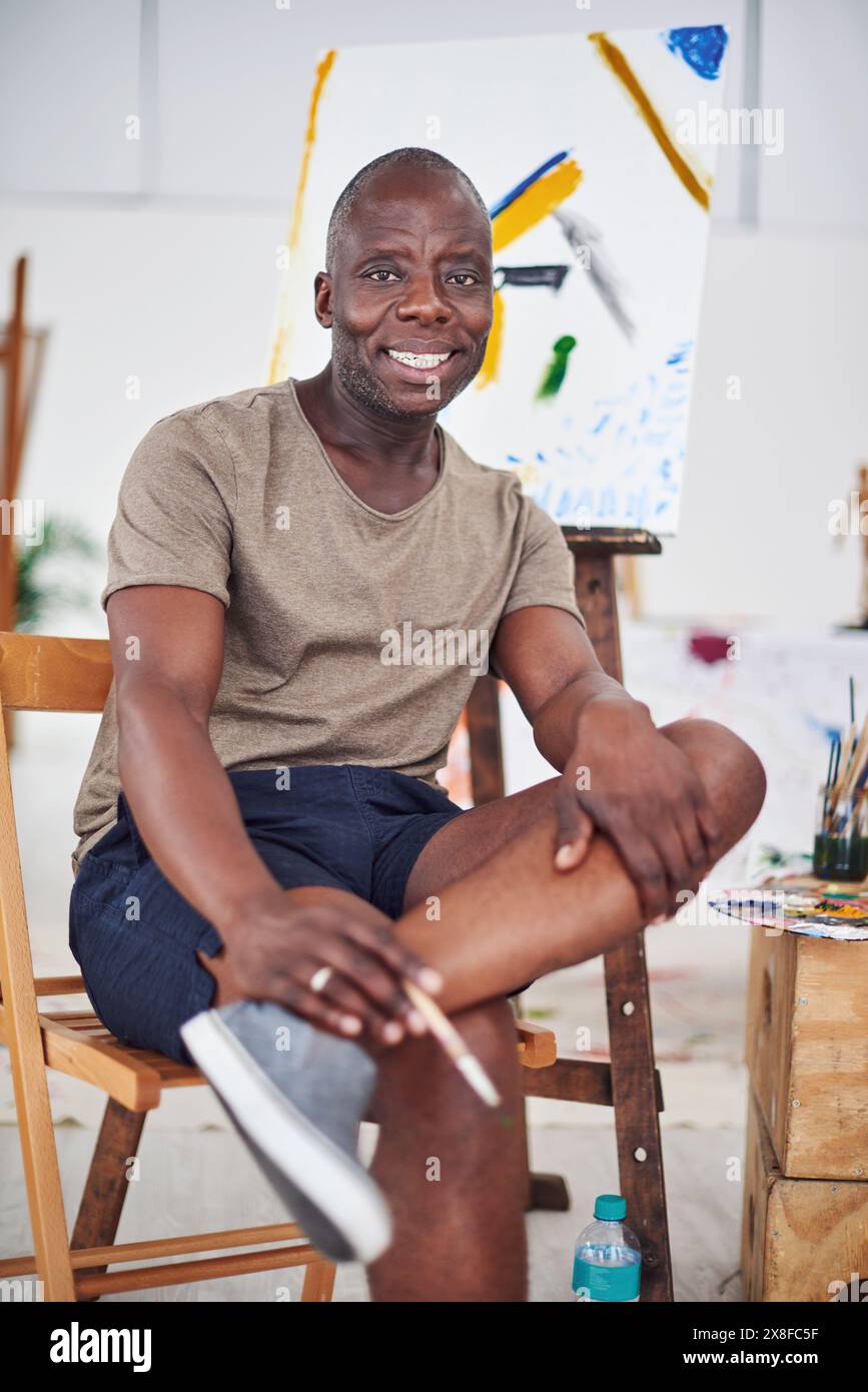 Portrait, happy and African man in art studio for painting, creativity ...