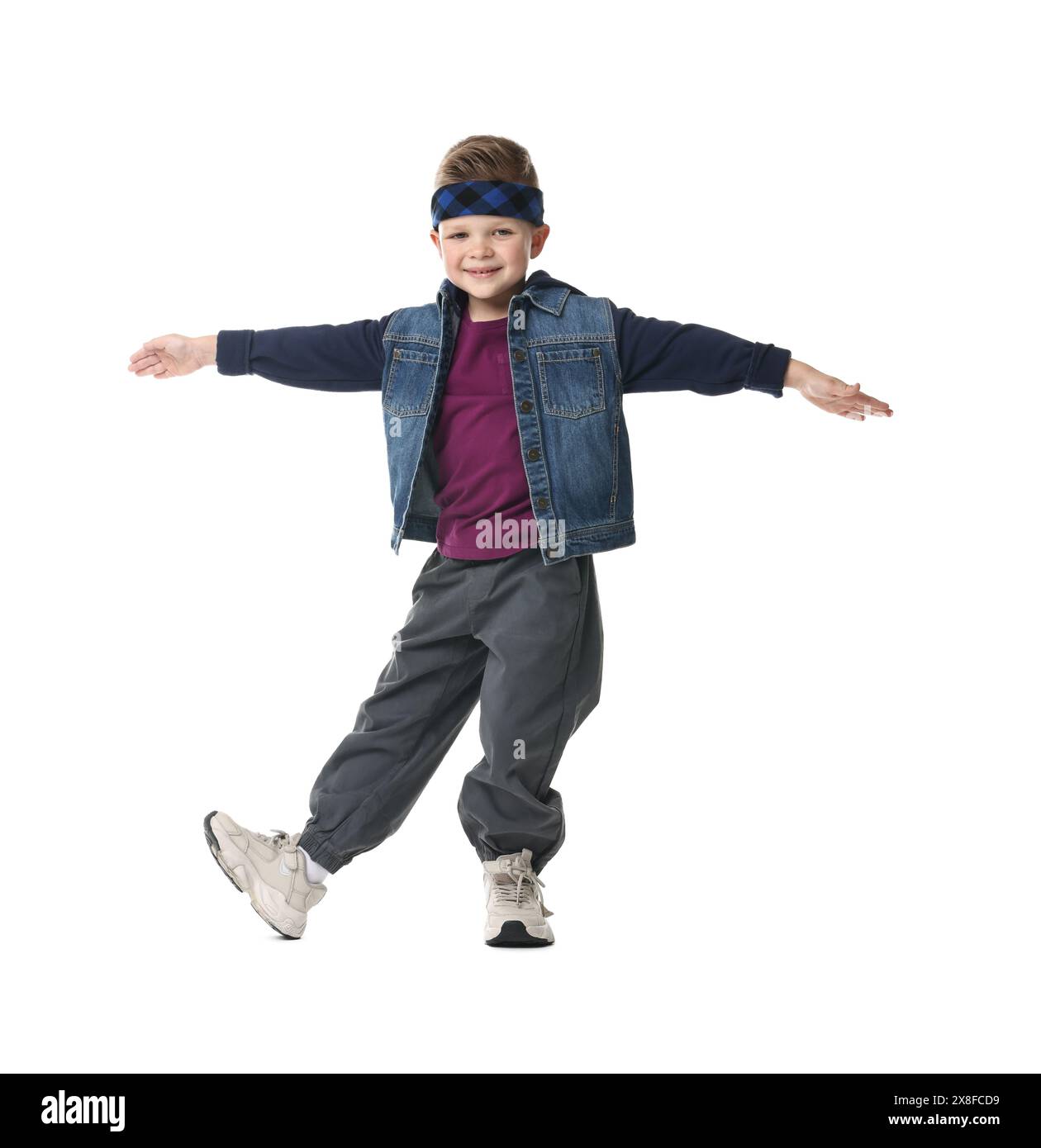 Happy little boy dancing on white background Stock Photo - Alamy