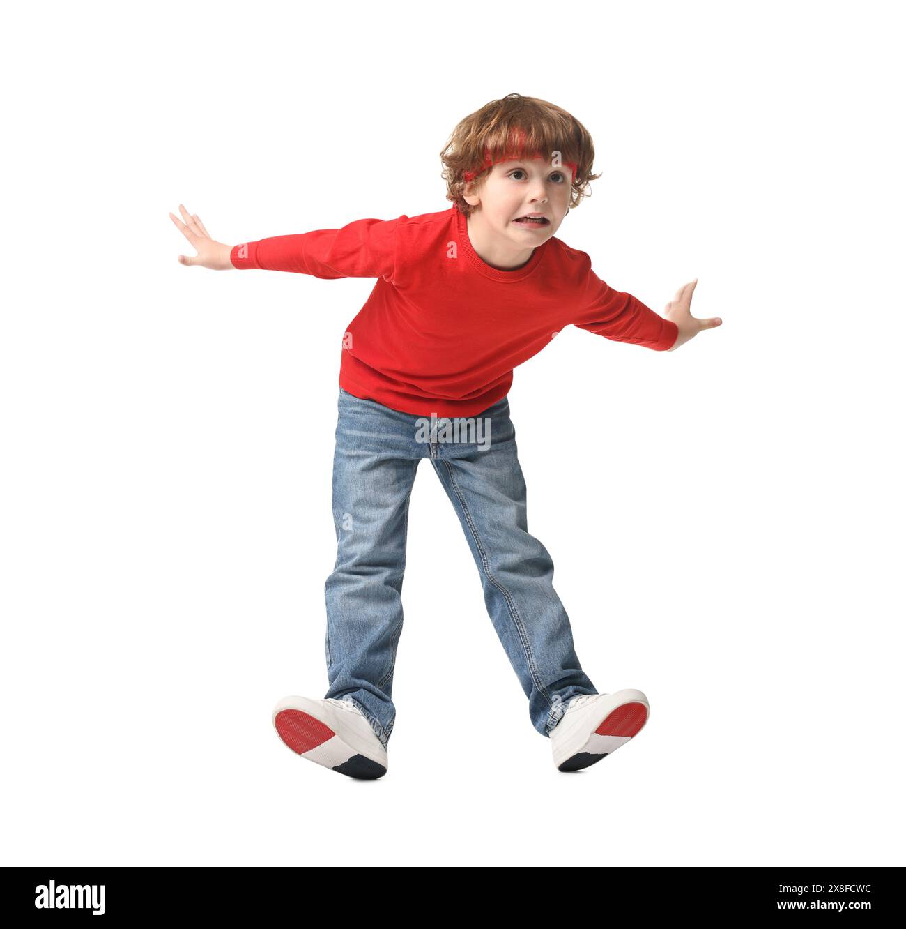 Happy little boy dancing on white background Stock Photo - Alamy