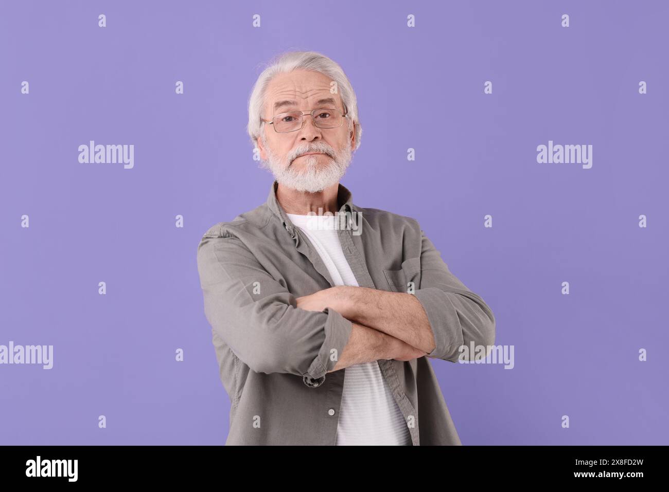 Portrait of stylish grandpa with glasses on purple background Stock ...