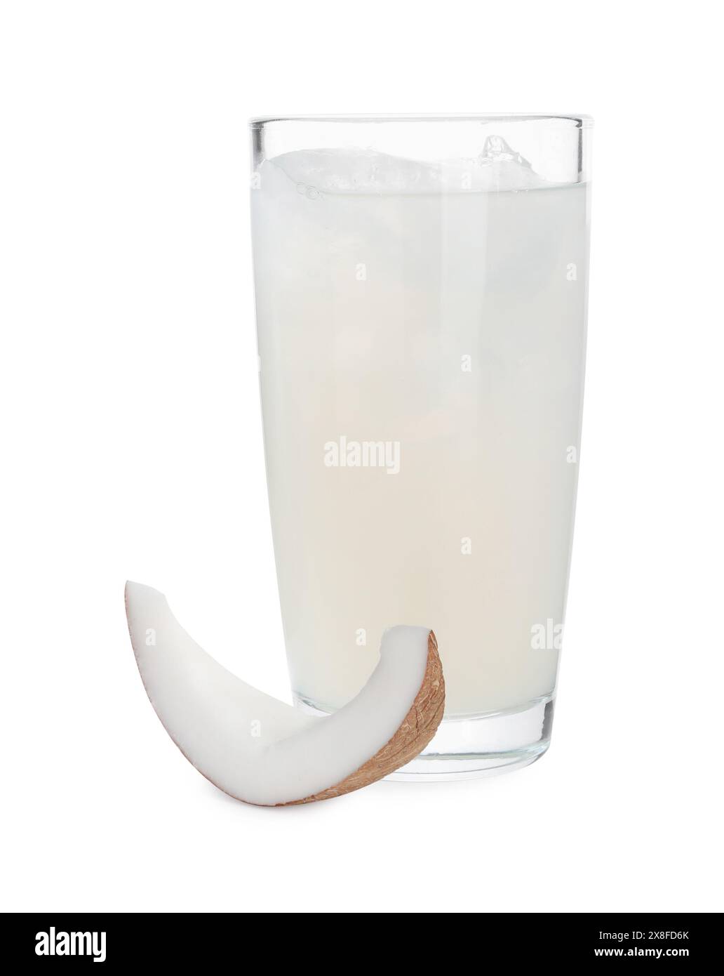 Glass of coconut water, ice cubes and nut isolated on white Stock Photo ...