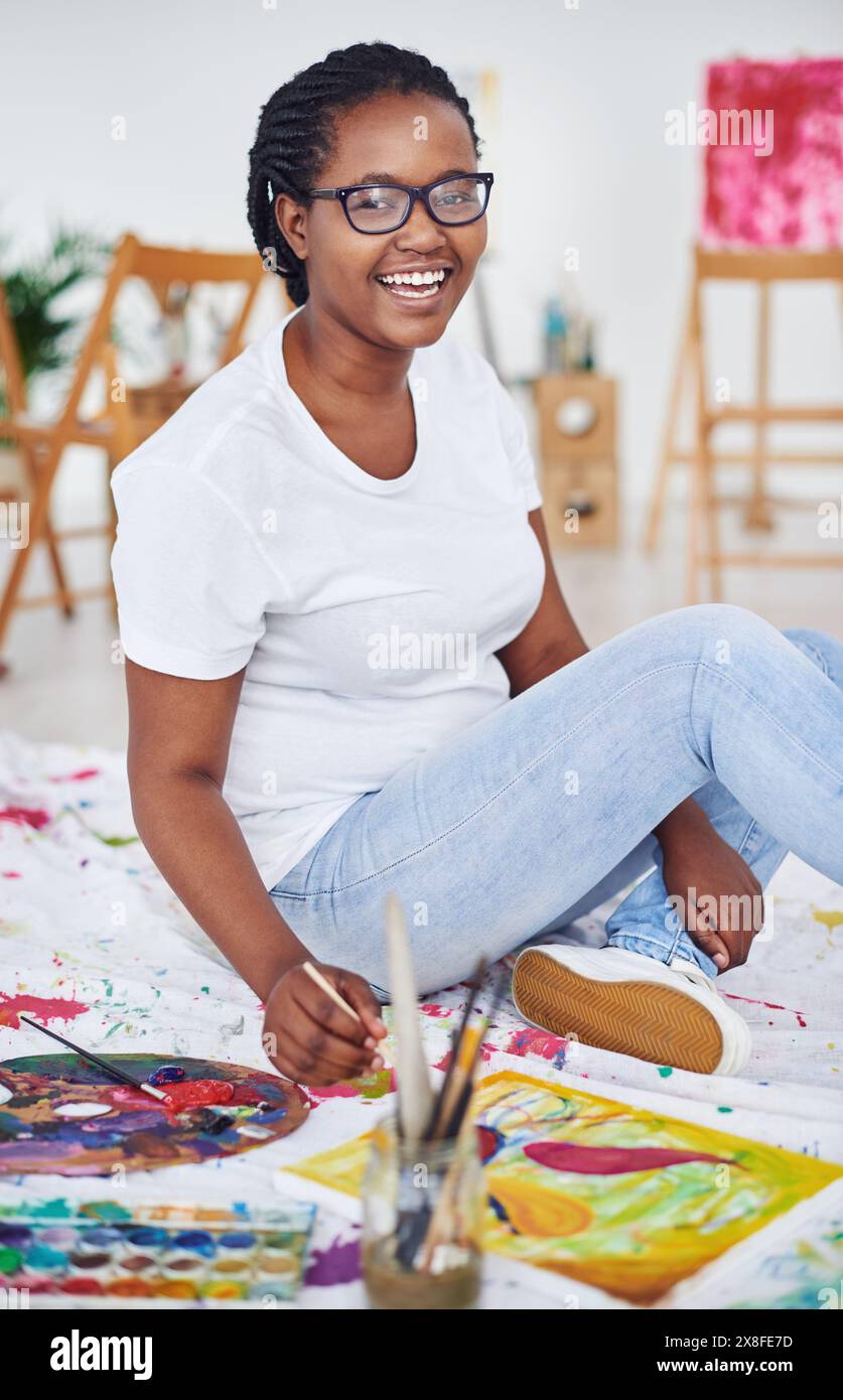 Portrait, happy and woman with art on floor for creating, painting and ...