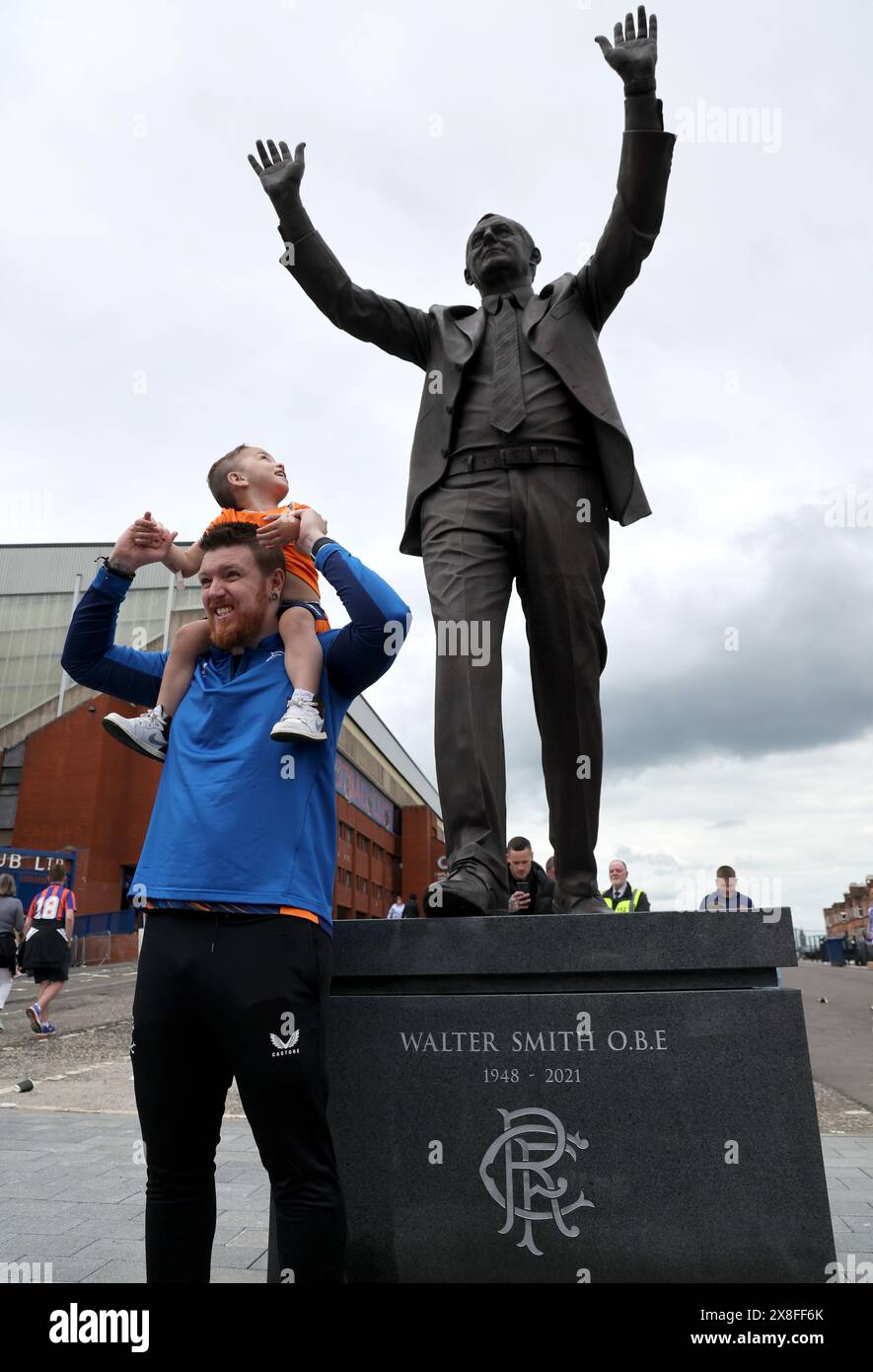 Fans pose next to a statue of Walter Smith unveiled at Ibrox Stadium ...