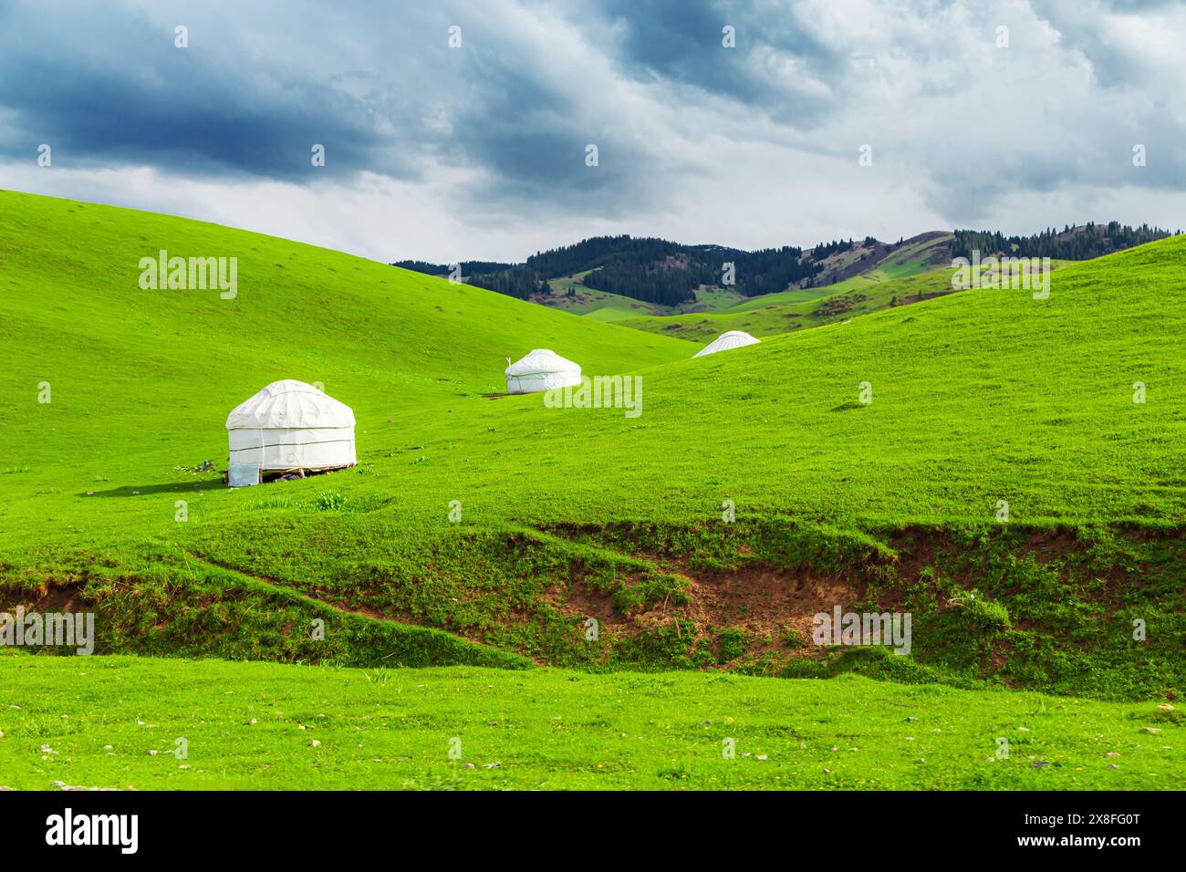 Beautiful spring landscape in the mountains with yurts - traditional ...
